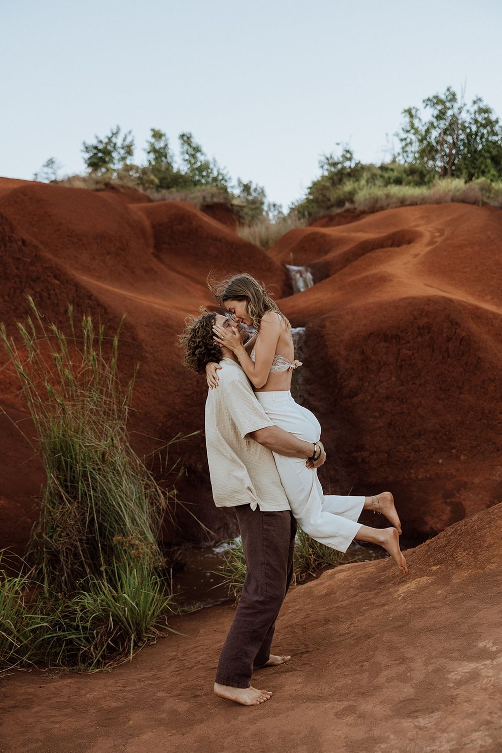 Red Dirt Falls Couple Photoshoot in Kauai - Abigail Traver Photo