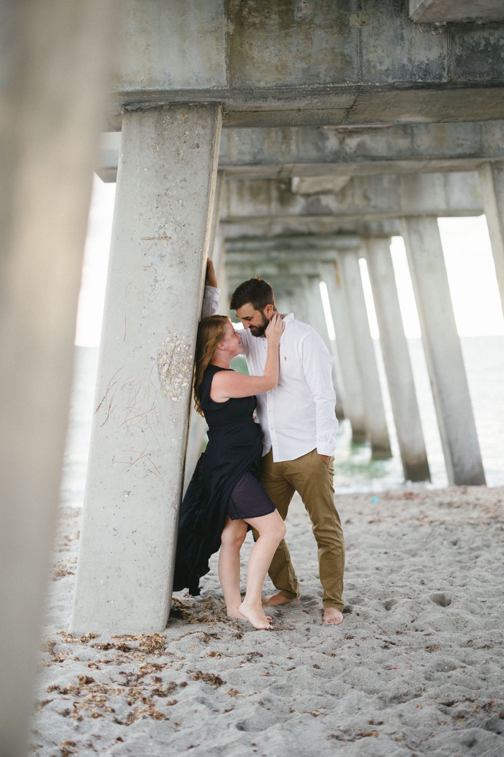 Nathan + Emily | Stormy Engagement Shoot at Sharky's Pier - Katie ...